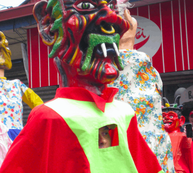 Masquerade parades in Costa Rica through Plaza de la Cultura