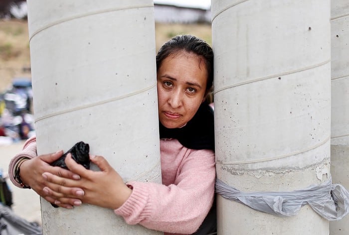 US says migrant arrivals from Mexico drop by half after rule change ...